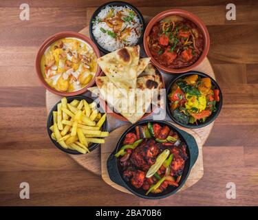Indian style tapas curry selection which made with chicken, lamb ...