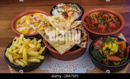 Indian style tapas curry selection which made with chicken, lamb ...