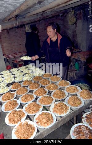 Chinese rural wedding banquet, a wide variety of dishes, many people ...