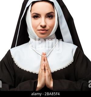 beautiful smiling nun praying with hands together isolated on white ...