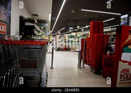 Nis,Serbia,March 08,2020: entrance to MAXI store, small shopping cart ...