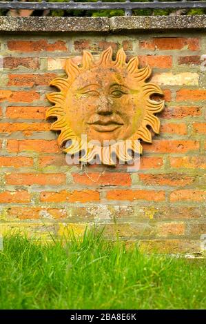 Ornamental terracotta sun face Stock Photo - Alamy
