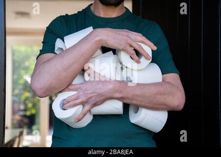 Man hoarding toilet roll during Coronavirus pandemic panic buying Stock ...
