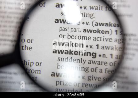 The word of phrase awaken and awakening in a dictionary Stock Photo - Alamy