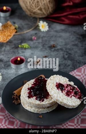 Rice cracker with red berry jam Stock Photo - Alamy