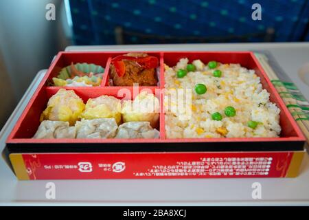 A bento box on a shinkansen bullet train departing Tokyo, Japan Stock ...