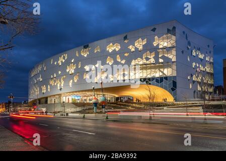 Exterior of the New Calgary Central Library. The exterior is a textured ...