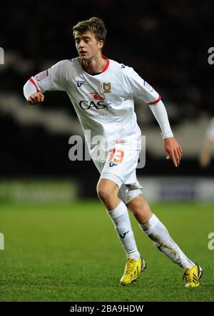 Milton Keynes Dons' Patrick Bamford holds off a challenge from Swindon ...