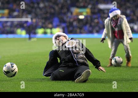 Young festively dressed Everton fans show off their skills at half-time ...