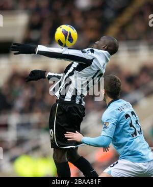 Newcastle United's Demba Ba (left) scores his sides first goal of the ...