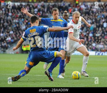 AFC Wimbledon's Steven Gregory (centre) battles Ebbsfleet United's ...