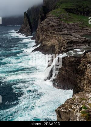 Bosdalafossur waterfall and Sorvagsvatn lake on Vagar island coastline ...