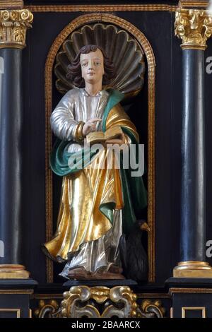Saint John, a statue on the pulpit in the parish church of Saint ...