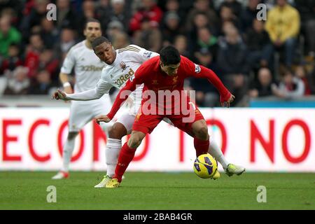 Liverpool's Luis Suarez and Swansea City's Jonathan de Guzman (left ...
