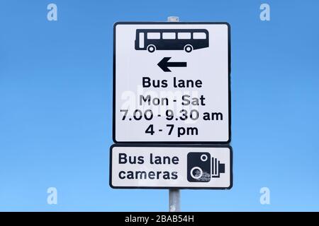 Bus lane camera symbol icon sign against blue sky at station in city ...