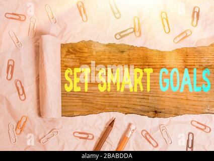Writing note showing Set Smart Goals. Business concept for list to ...