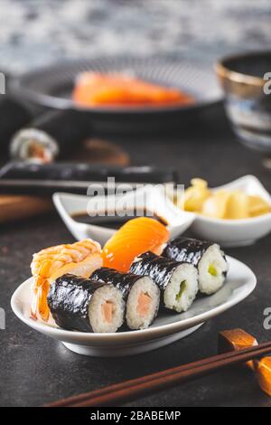 Maki sushi roll with avocado with chopsticks. Sushi menu. Japanese food ...