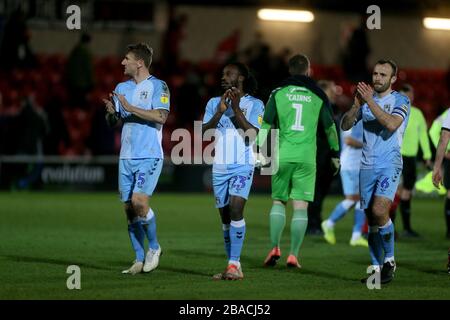 Coventry City's Liam Kelly and Kyle McFadzean challenge Doncaster ...