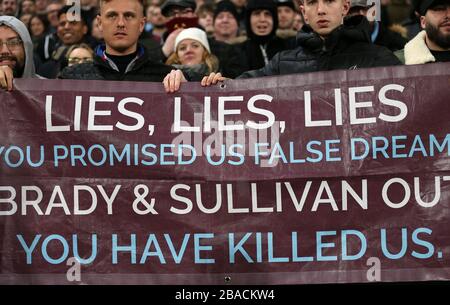 West Ham United fans hold red cards in protest of club ownership during ...