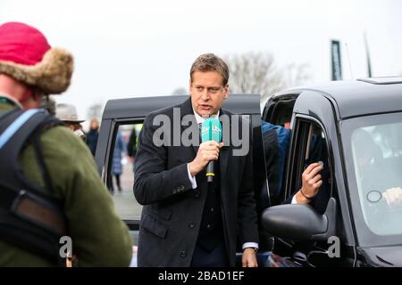 ITV's Ed Chamberlin during filming in a branded Cheltenham Festival ...