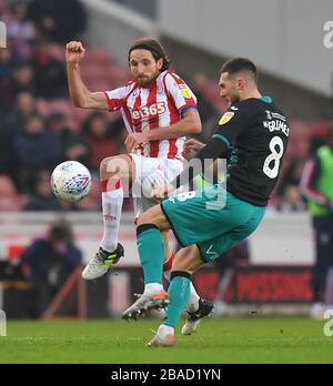 Swansea City's Matt Grimes (left) and Cardiff City's Ryan Wintle battle ...
