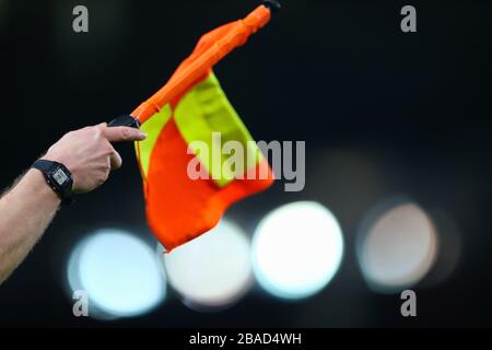 The linesman raises his flag Stock Photo - Alamy