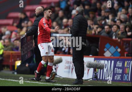 Charlton Athletic's Aaron Henry shakes hands with manager Lee Bowyer as ...