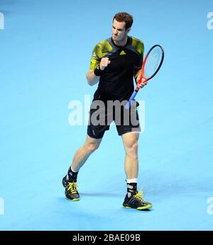 Andy Murray celebrates winning the first set in the Men's Doubles final ...