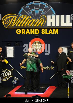 Brendan Dolan celebrates his victory over Colin Osborne during day ...