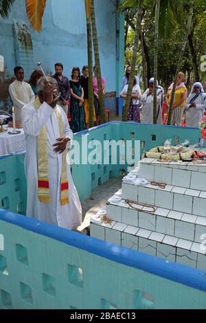 The priest blesses religious objects at the tomb of a Croatian ...