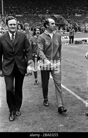 Sunderland Manager Bob Stokoe (full tracksuit) leads out his side ...