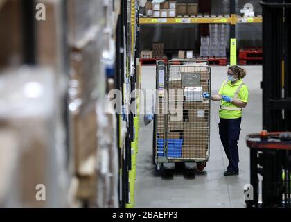 A worker gather supplies at the NHS' National Procurement Warehouse at ...