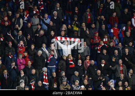 Arsenal fans in the stands Stock Photo - Alamy