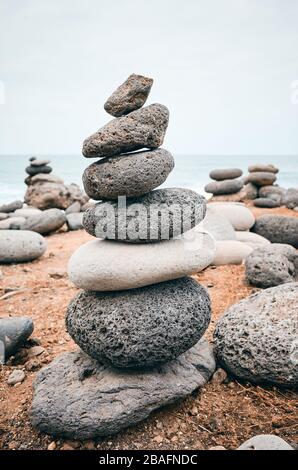 Stack of stone on the beach. Balance concept Stock Photo - Alamy