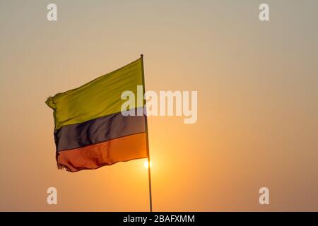 Colombian flag waving with sunset Stock Photo - Alamy