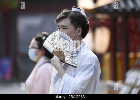 Young people wearing traditional Han clothes to welcome the traditional ...