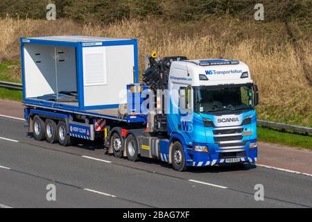 Heavy haulage lorry transporting prefabricated house module to building ...