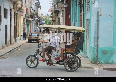 Bici-taxis in a street in Havana, Cuba Stock Photo - Alamy