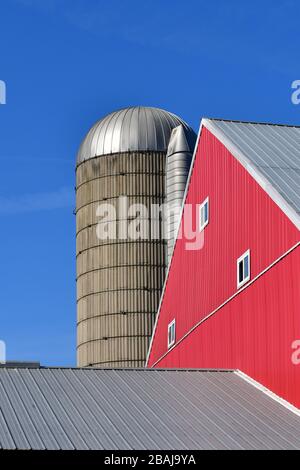 A Red Barn and silo against blue sky Stock Photo - Alamy