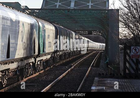 Long train of Drax Biomass rail freight wagons crossing the King George ...