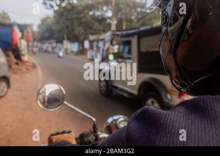Driving a motorcycle overlooking the Indian bazaar Stock Photo - Alamy