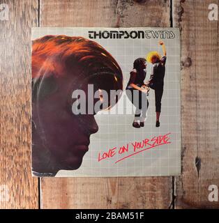 Thompson Twins - love on you side - 7 inch single Stock Photo - Alamy