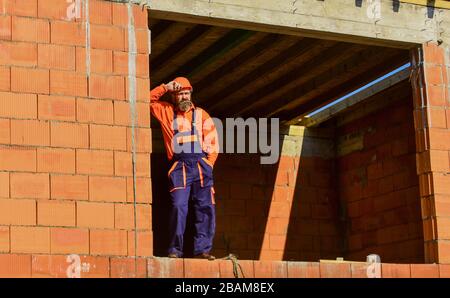 builder smoking cigarette in construction site Stock Photo - Alamy