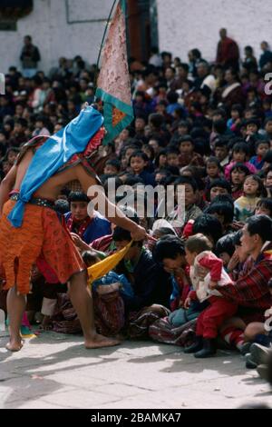 Painted devil dancers in costume at a parade for the Guelaguetza folk ...