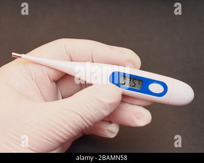 Subfebrile temperature. The display of the electronic thermometer shows ...