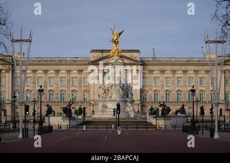 The morning sun hits Buckingham Palace, London as the clocks move ...