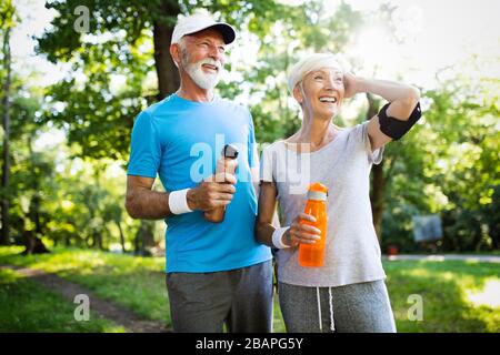 jogging friends couple congratulate and happy to finish their morning ...