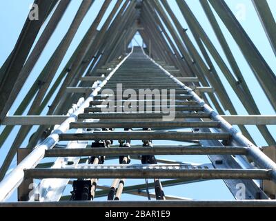 The photograph offers an upward perspective of a telecommunications ...