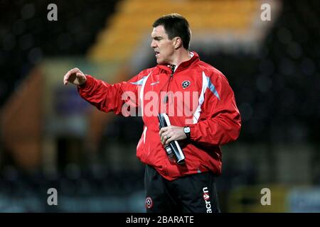 Sheffield United reserve team coach Chris Morgan (left) congratulates ...