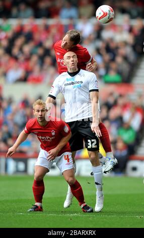 Derby Coumty's Connor Salmon is challenged by Nottingham Forest's Danny ...
